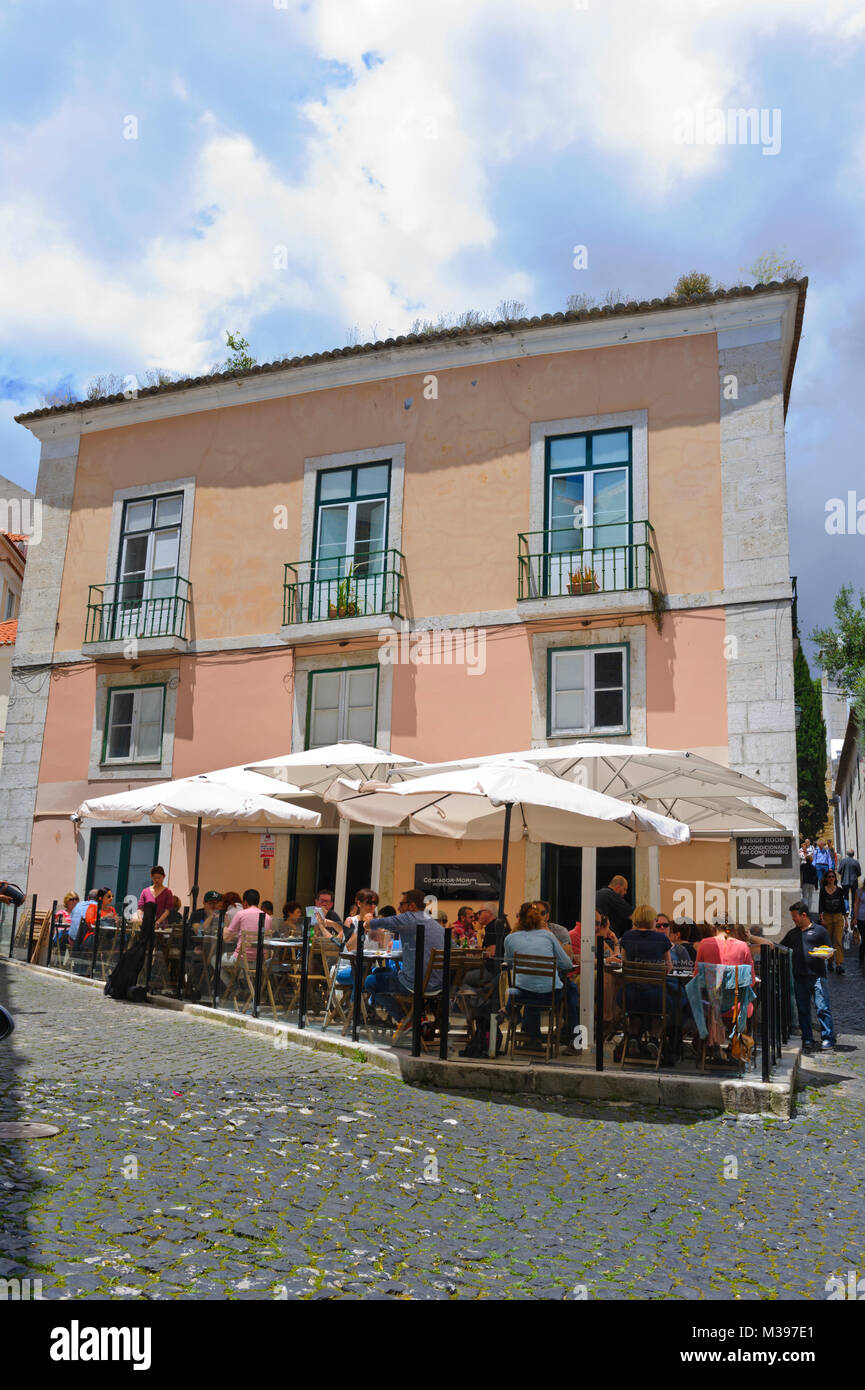 People sitting outside a cafe in Lisbon, Portugal Stock Photo - Alamy