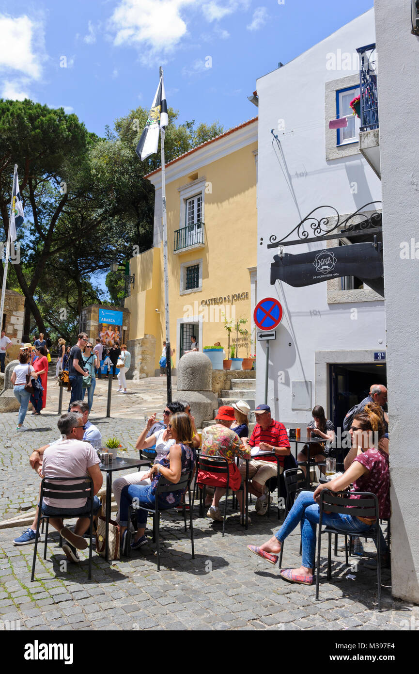 People sitting outside a cafe in Lisbon, Portugal Stock Photo - Alamy