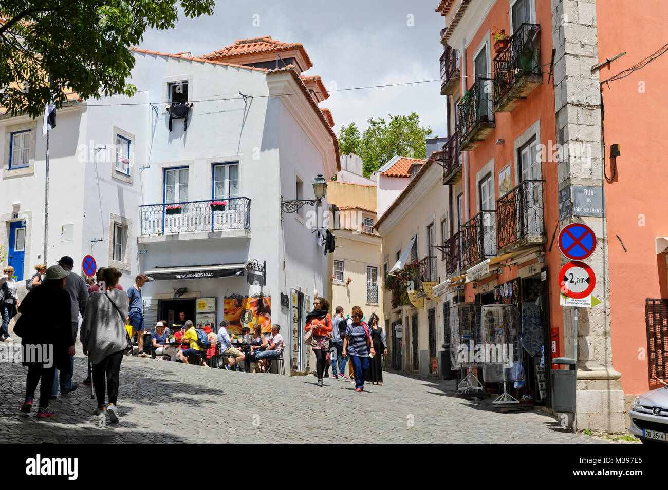 People sitting outside a cafe in Lisbon, Portugal Stock Photo - Alamy