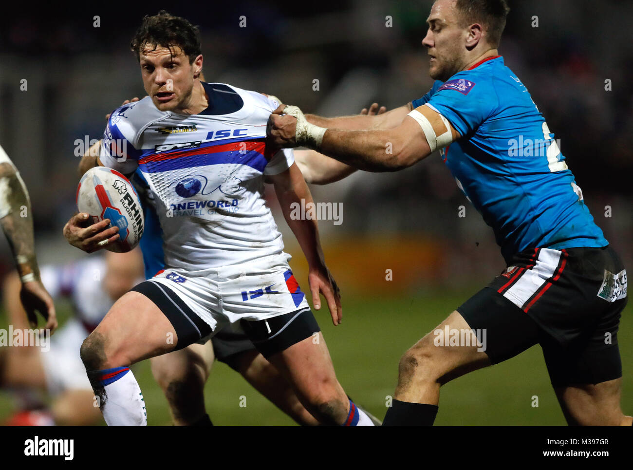 Wakefield Trinity's Scott Grix is tackled by Salford Red Devils' Lee ...