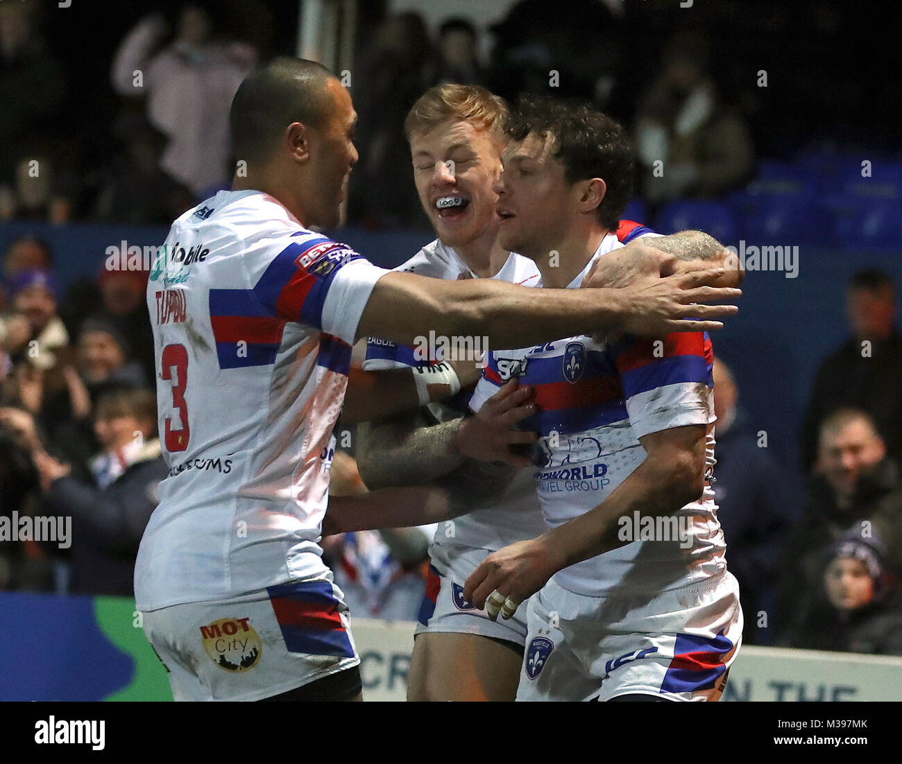 Wakefield Trinity's Scott Grix (right) celebrates scoring his side's ...