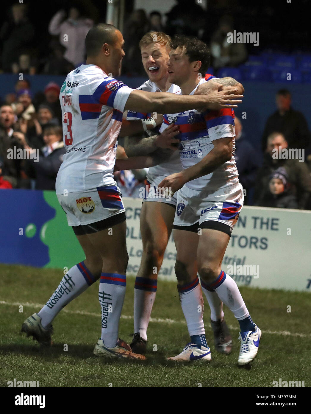Wakefield Trinity's Scott Grix (right) celebrates scoring his side's ...