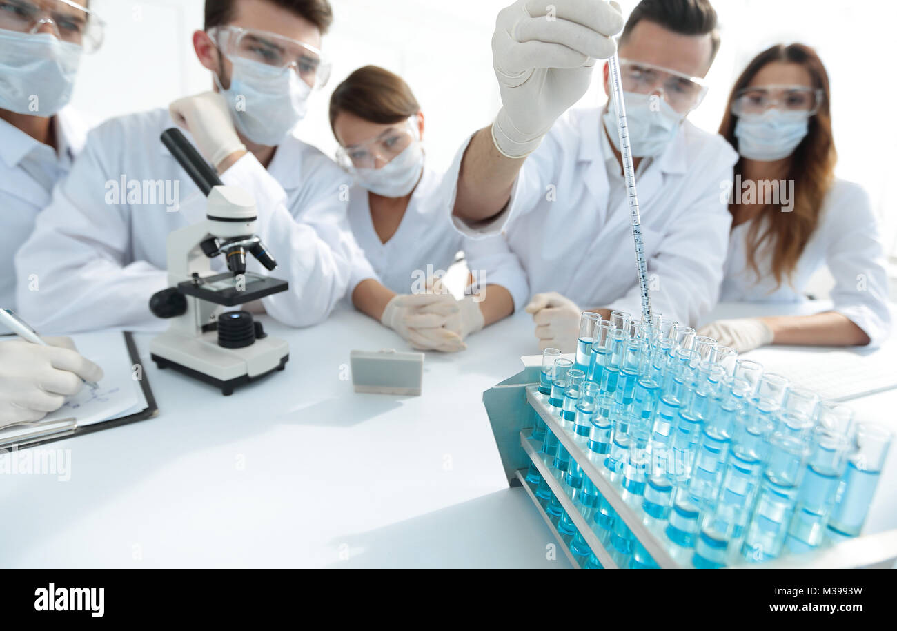 Scientists at chemical laboratory during work Stock Photo - Alamy
