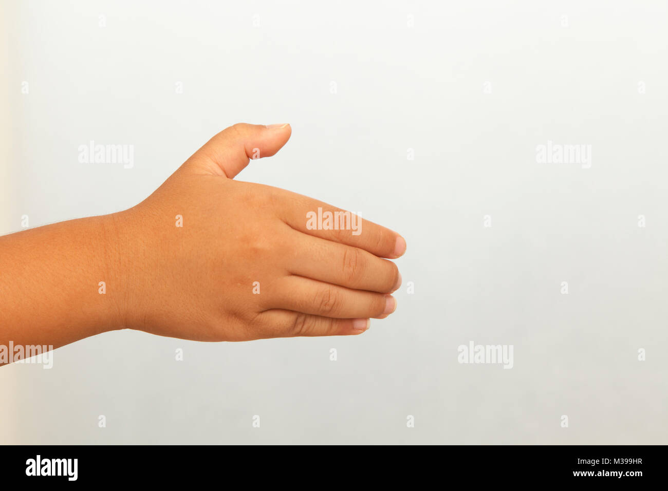 Hand of children seeking handshake Stock Photo - Alamy