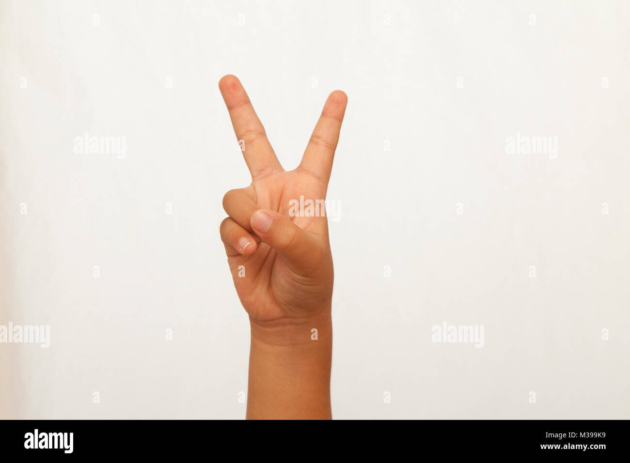 Children's hand showing two Stock Photo - Alamy