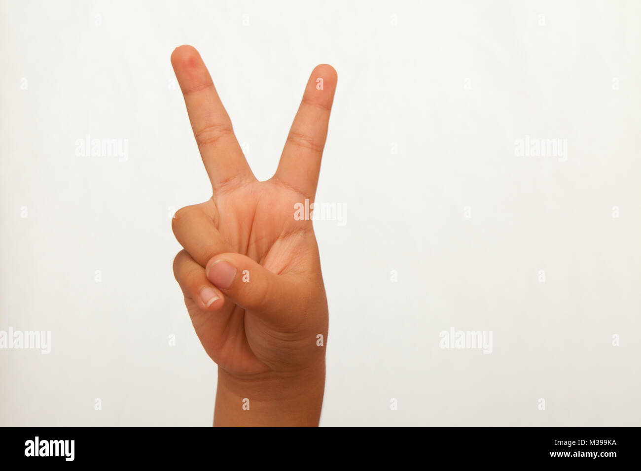 Children's hand showing two Stock Photo - Alamy