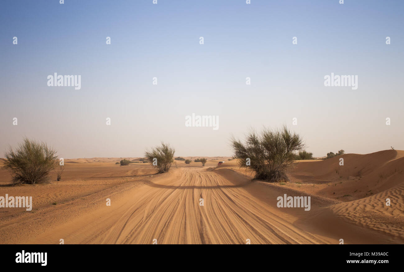 Desert sand road Stock Photo - Alamy