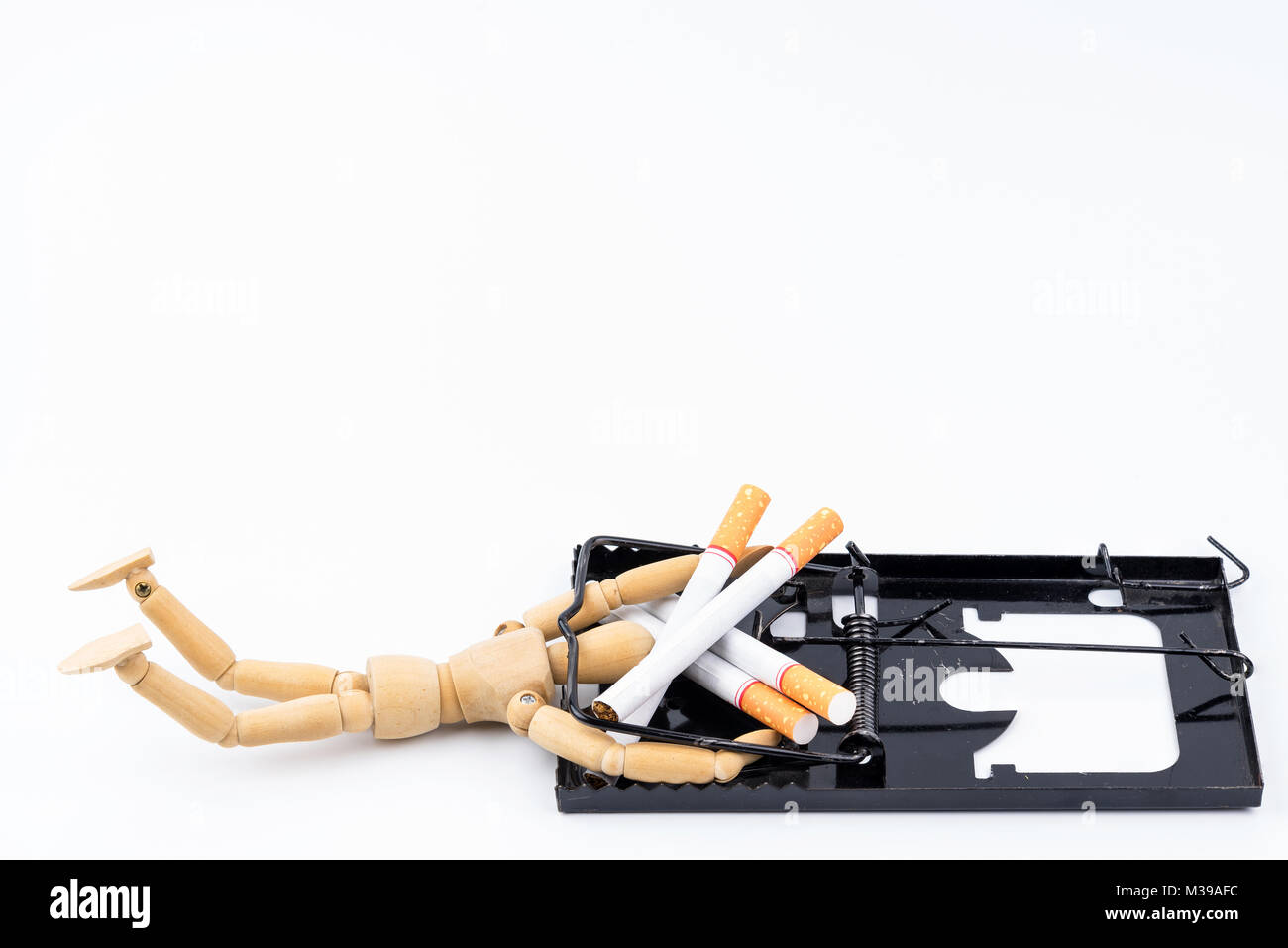 Wooden puppet caught in Mousetrap with cigarettes as bait.No Smoking ...