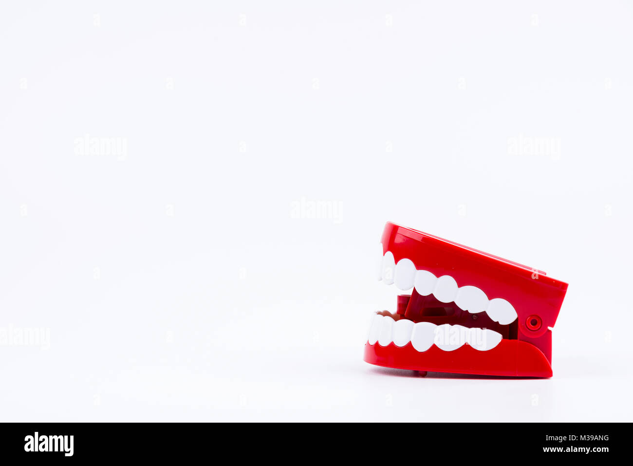 Red Plastic Wind Up Chattering Teeth isolated on White Background Stock ...