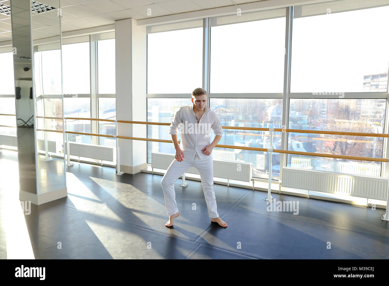 Guy making somersault backwards at studio Stock Photo - Alamy