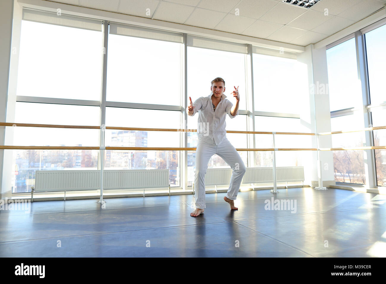 Dance school graduate making body movements Stock Photo - Alamy