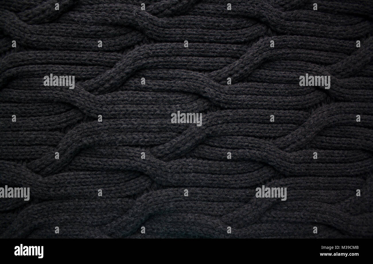 Black woolen cable knit pattern abstract background Stock Photo - Alamy