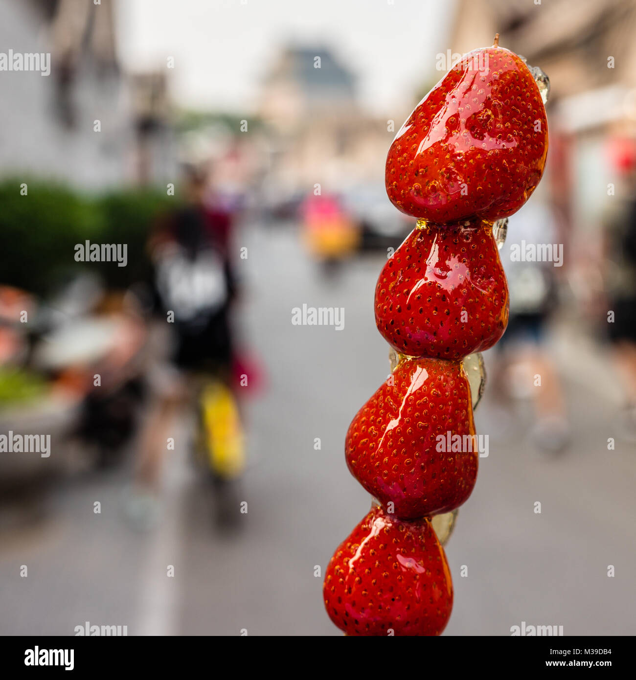 Strawberry skewers in crispy caramel, street food in Beijing, China ...