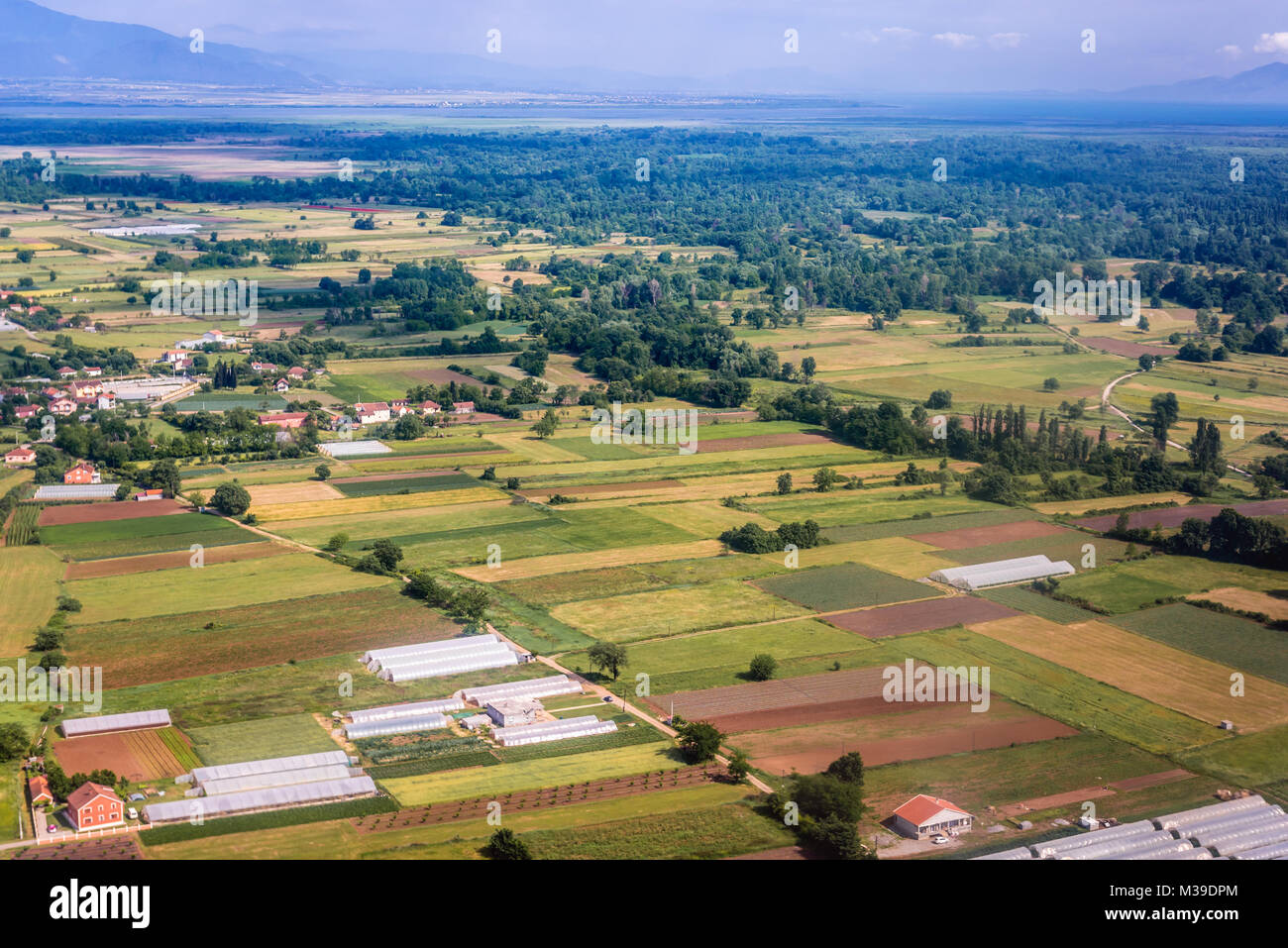 Aerial view from plane window on rural area of Zeta Plain around ...