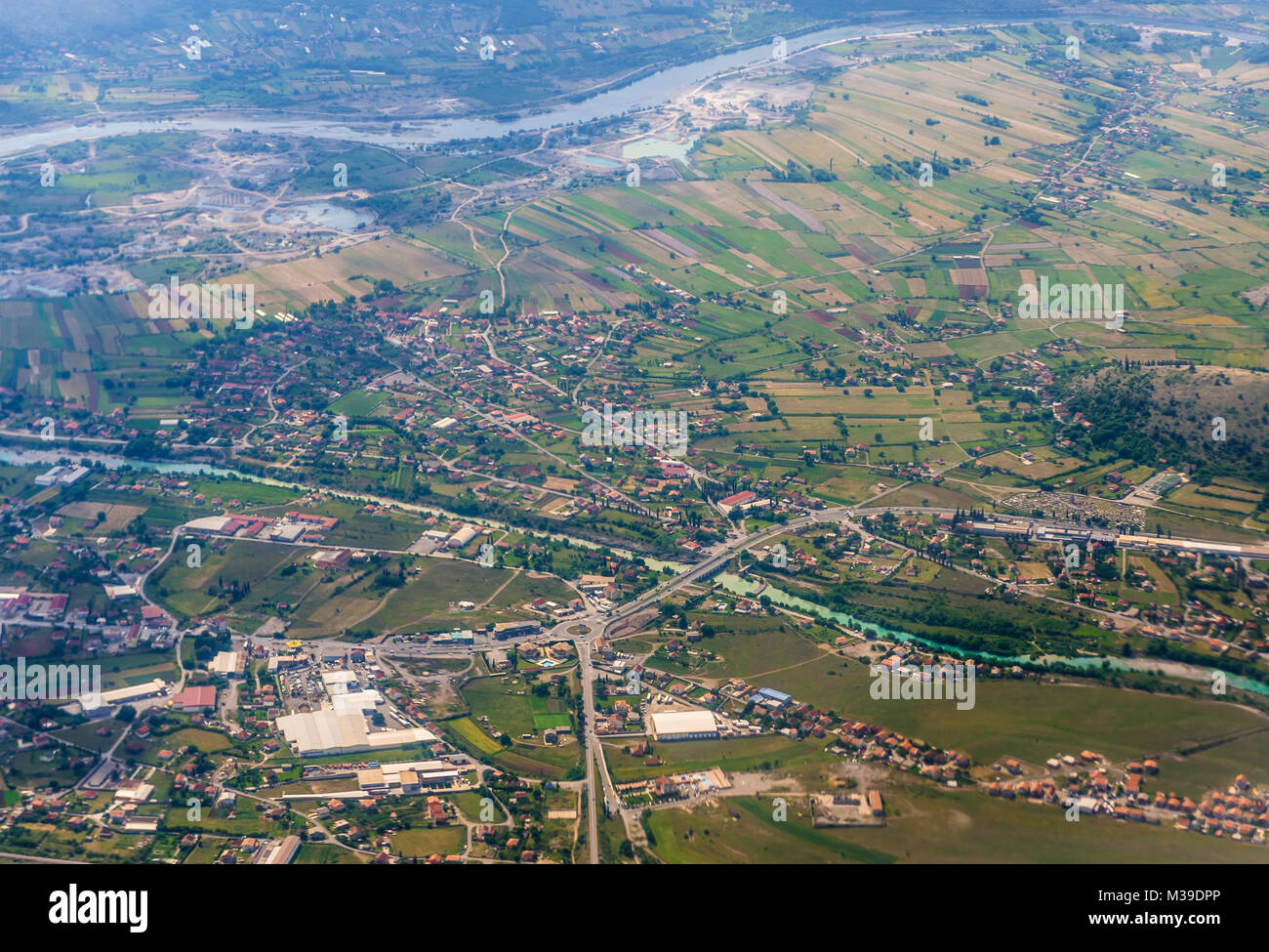 Aerial view from plane window on rural area around Podgorica Airport in ...
