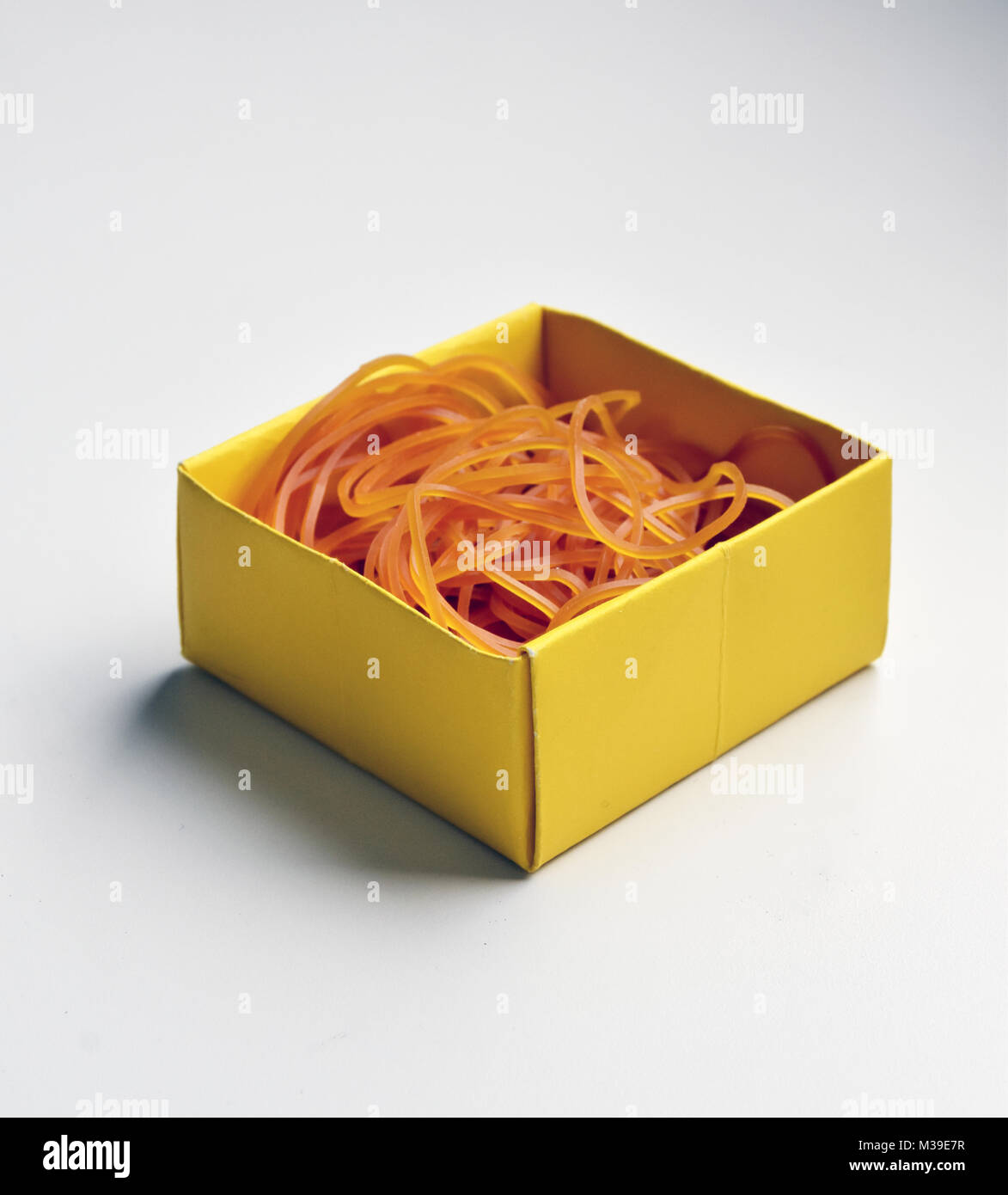 Stationery boxes filled with elastic bands, paper clips, staples and ...