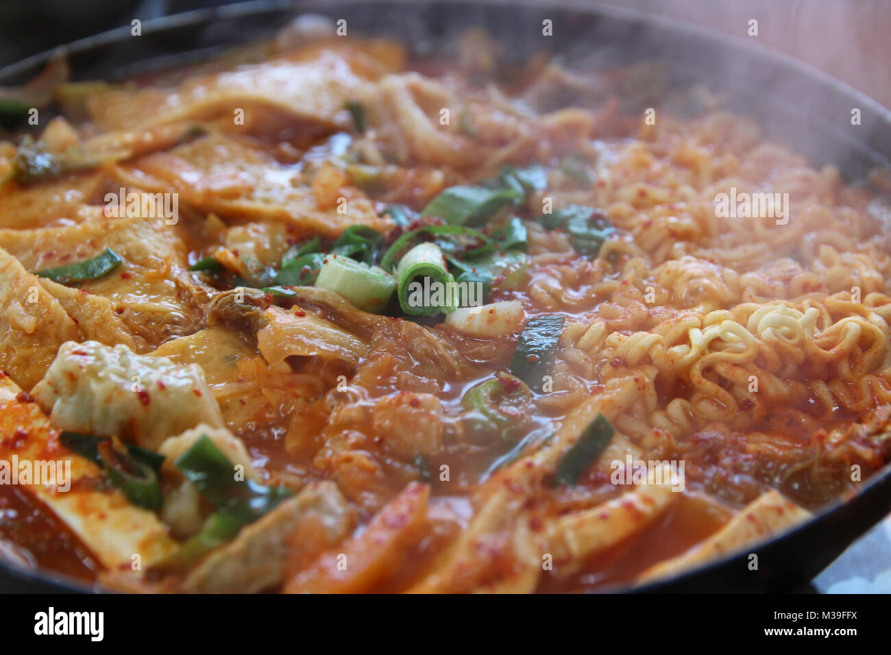 Close up of Korean Army Stew (Budae Jjigae) hot pot at Korean ...