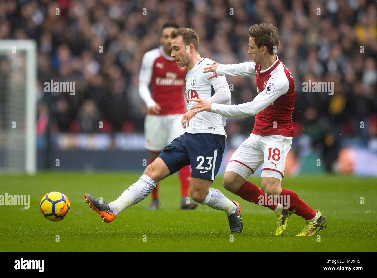 Tottenham Hotspur's Christian Eriksen (left) and Arsenal's Nacho ...