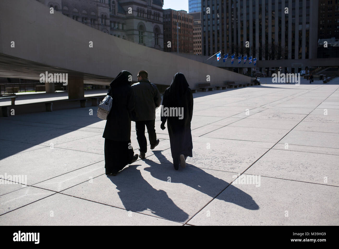 People believed to be the family of Raed Jaser enter the Old City Hall ...