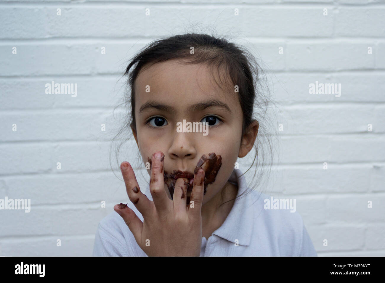 Eating chocolate hi-res stock photography and images - Alamy