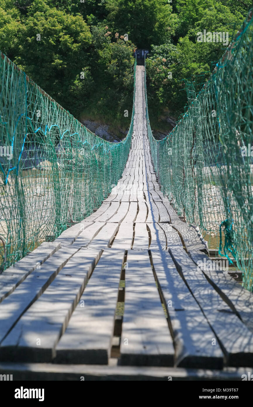Hanging walking bridge across gorge of the river Stock Photo - Alamy