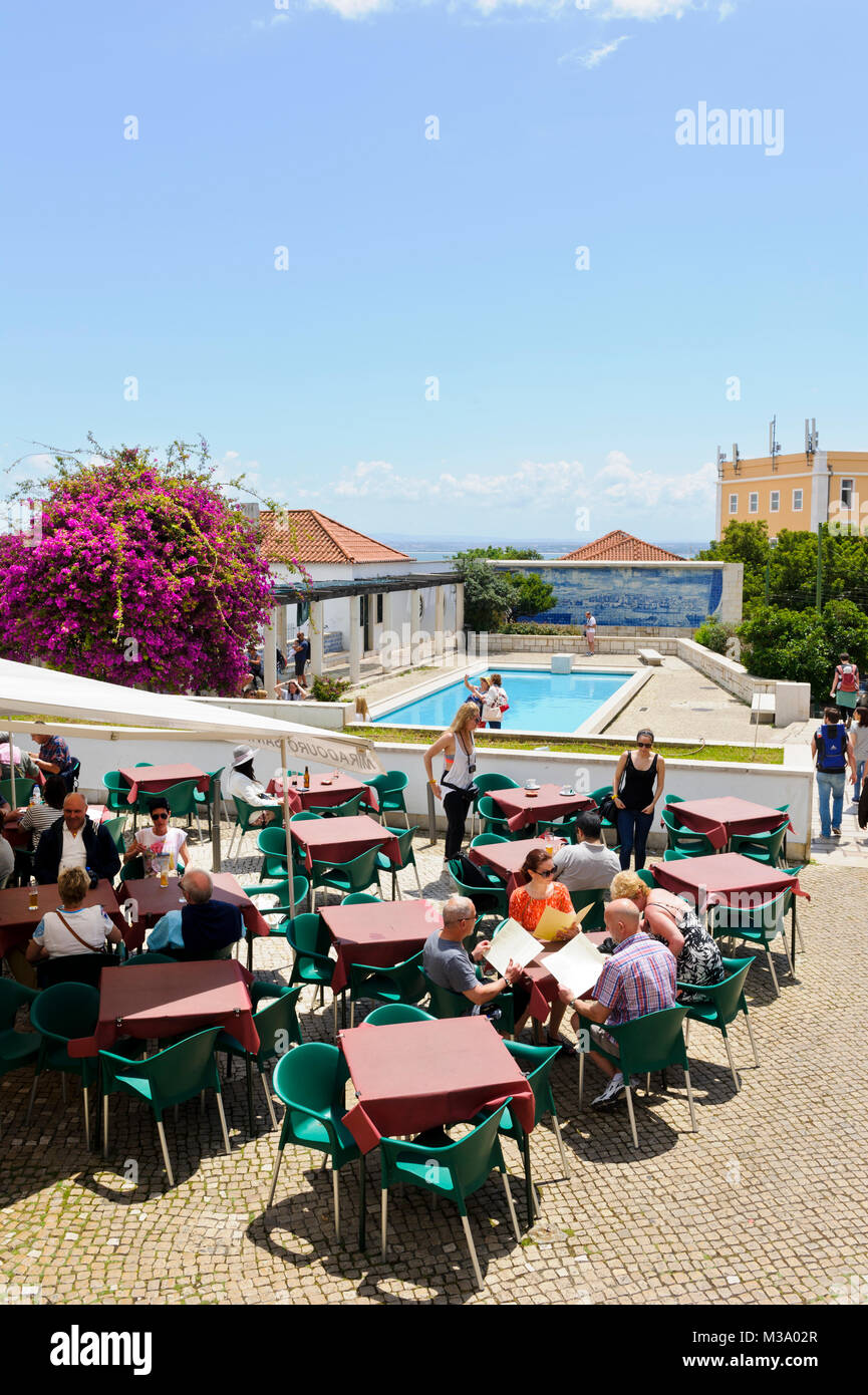 People sitting outside a cafe in Lisbon, Portugal Stock Photo - Alamy