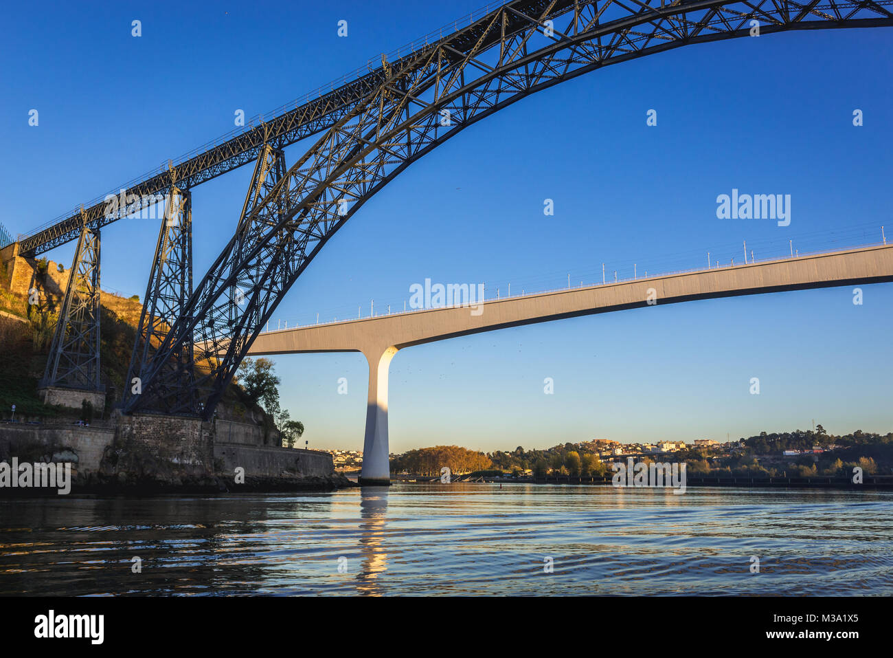 Old Maria Pia Bridge and new railway bridge of Saint John over Douro ...