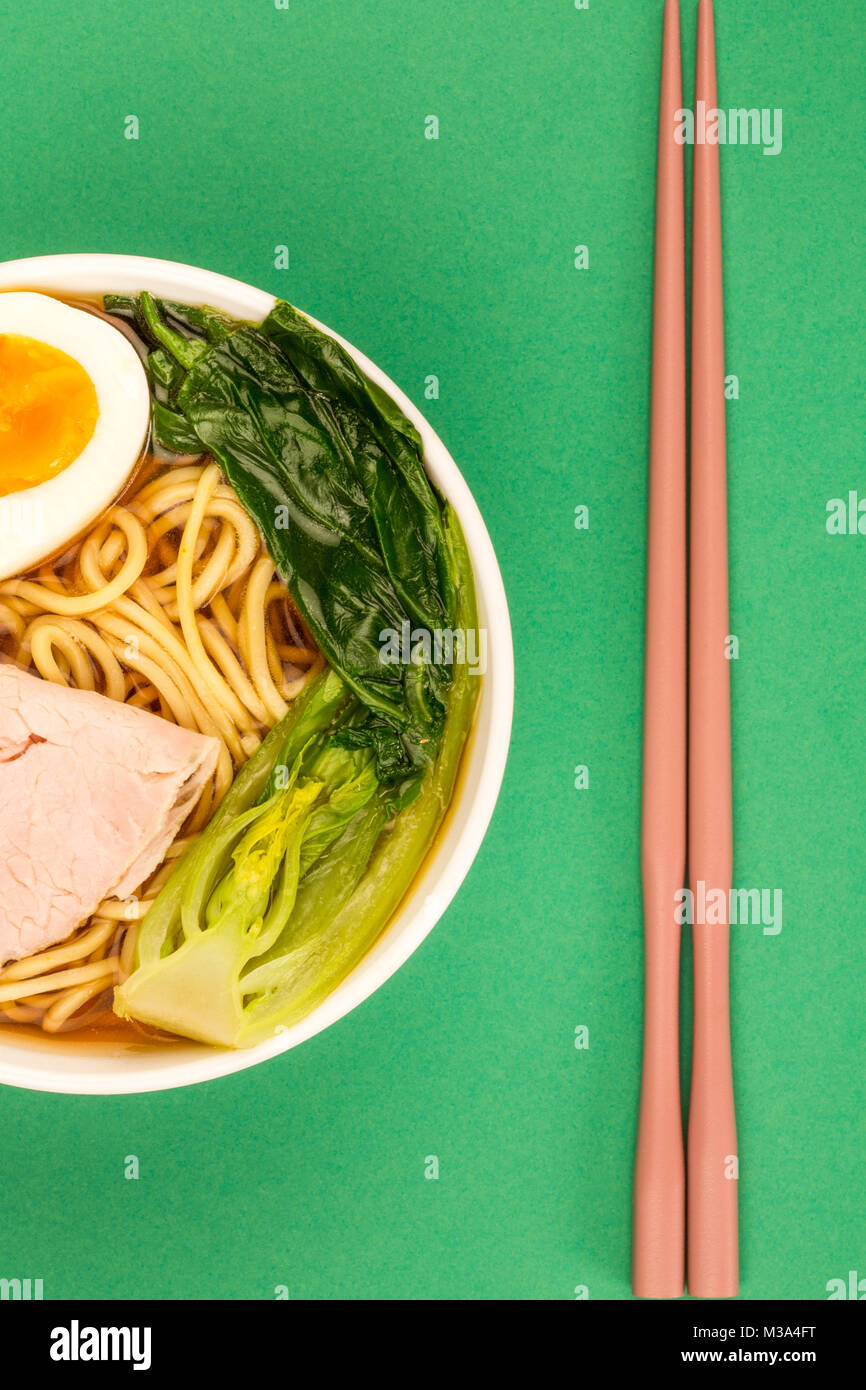 Bowl Of Japanese Style Pork Ramen Noodle Soup With Pak Choi And A