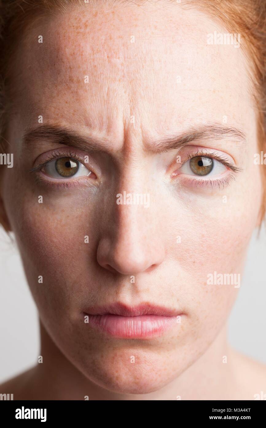 MODEL RELEASED. Close-up of young woman looking angry Stock Photo - Alamy