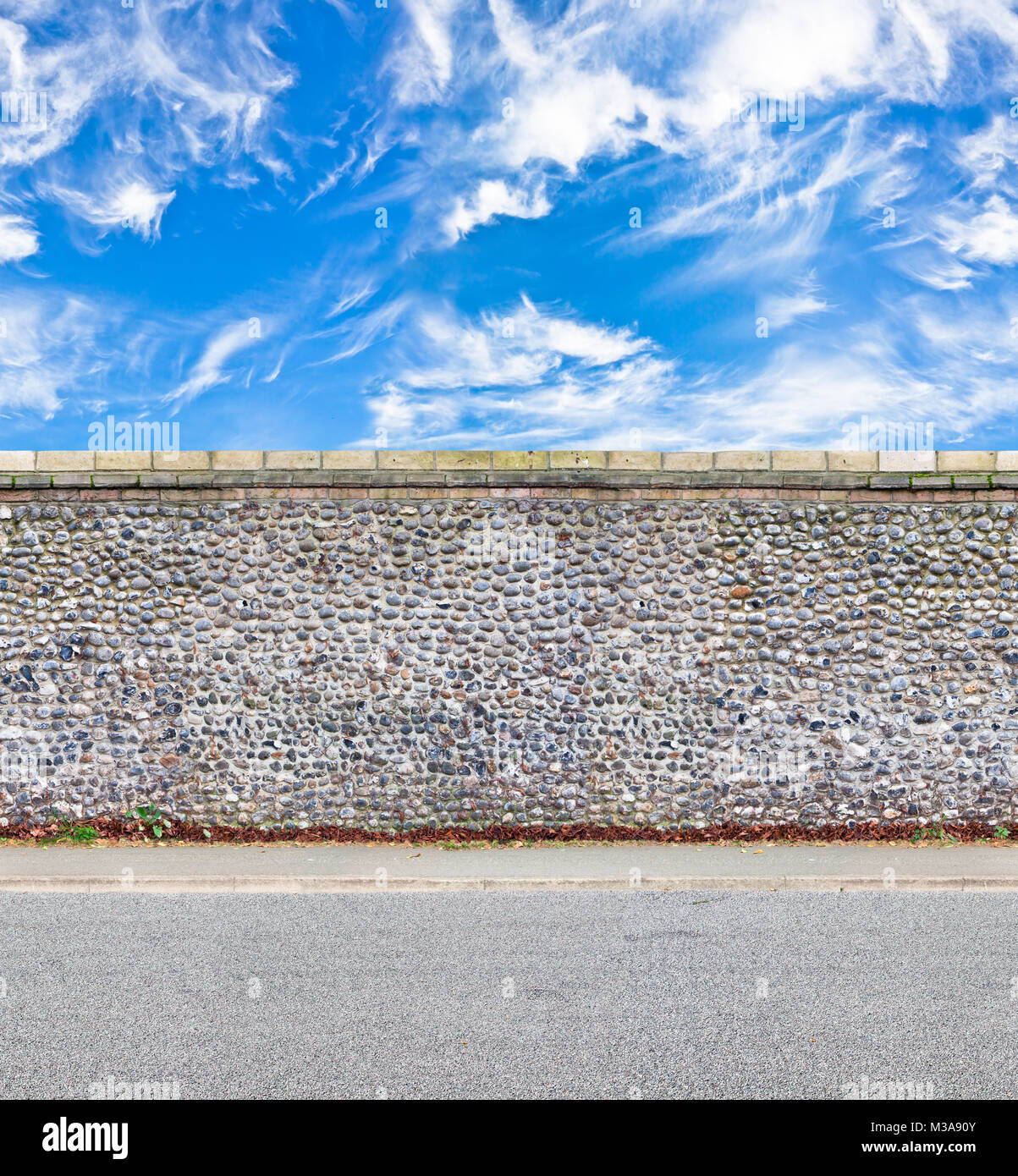 stone wall with the gravel road and skies horizontalseamless image ...
