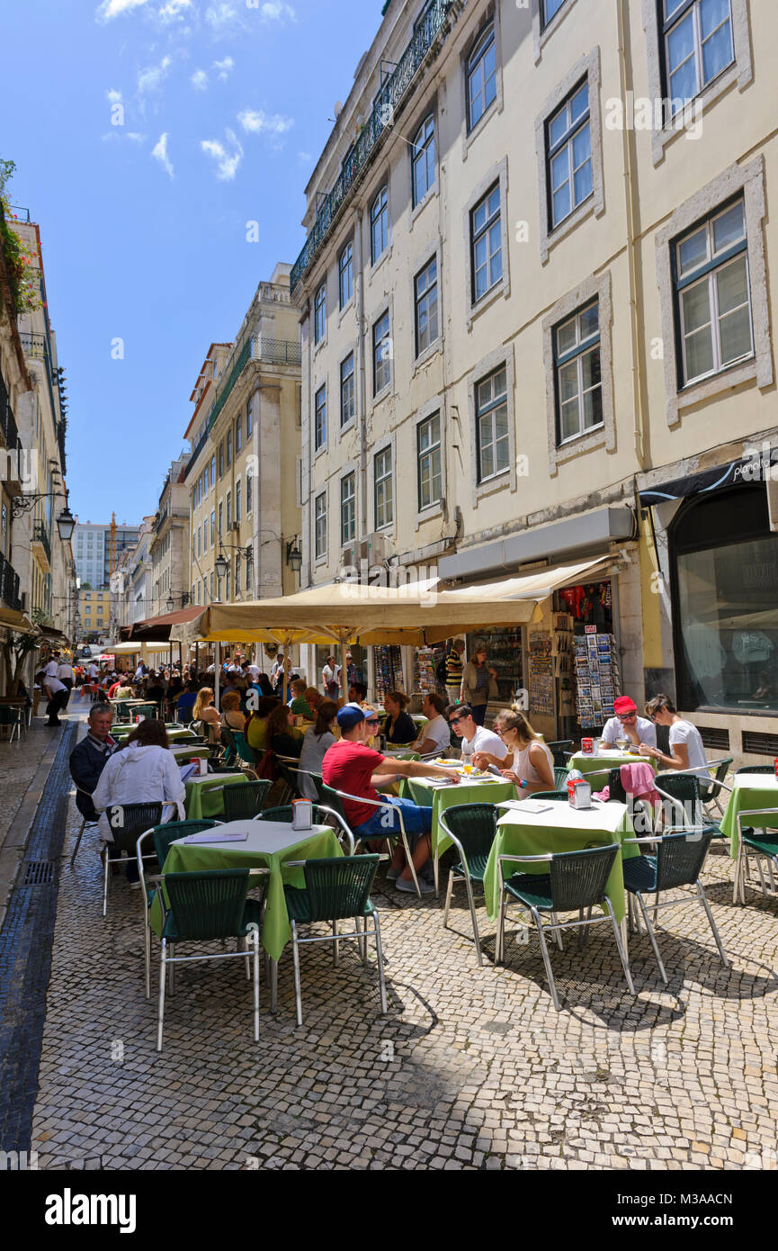 People sitting outside a cafe in Lisbon, Portugal Stock Photo - Alamy