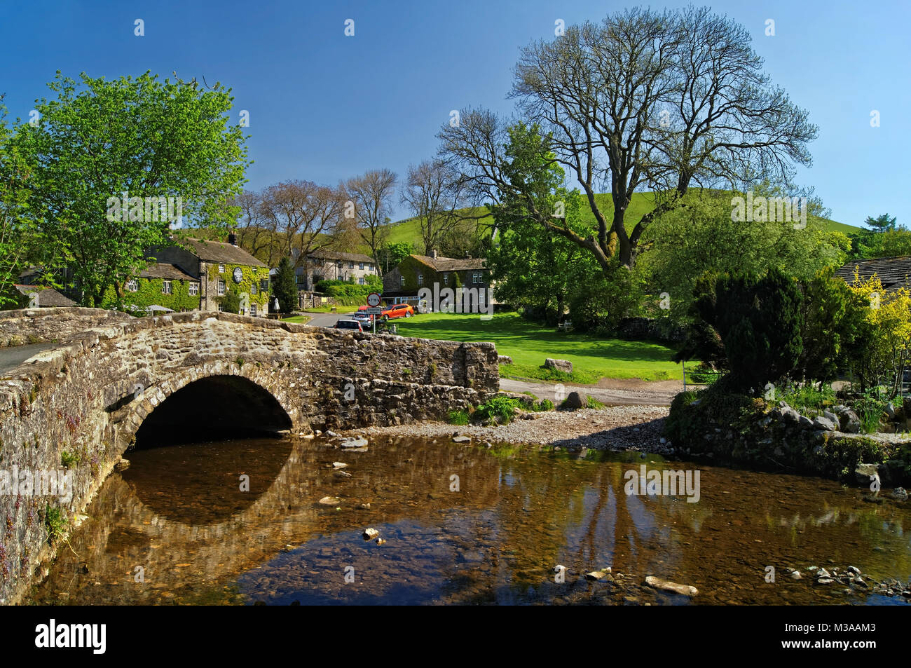 UK, North Yorkshire, Yorkshire Dales, Malham, Bridge over Malham Beck ...