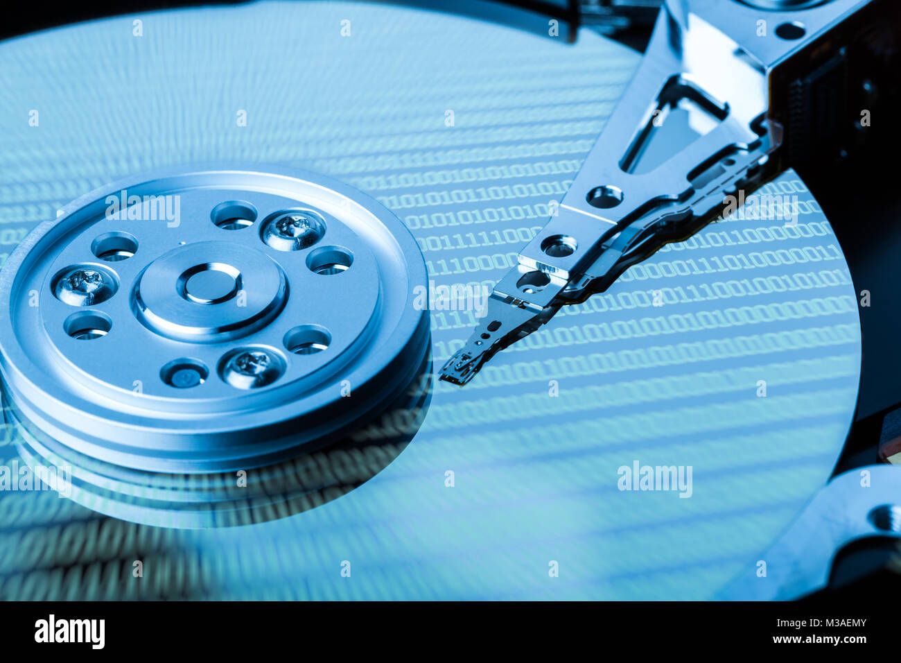 Close up of hard disk with binary language reflection on surface Stock ...