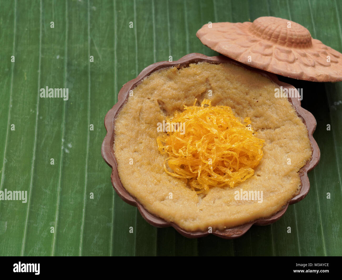 Thai dessert, egg custard with sweet sticky rice topped with golden ...