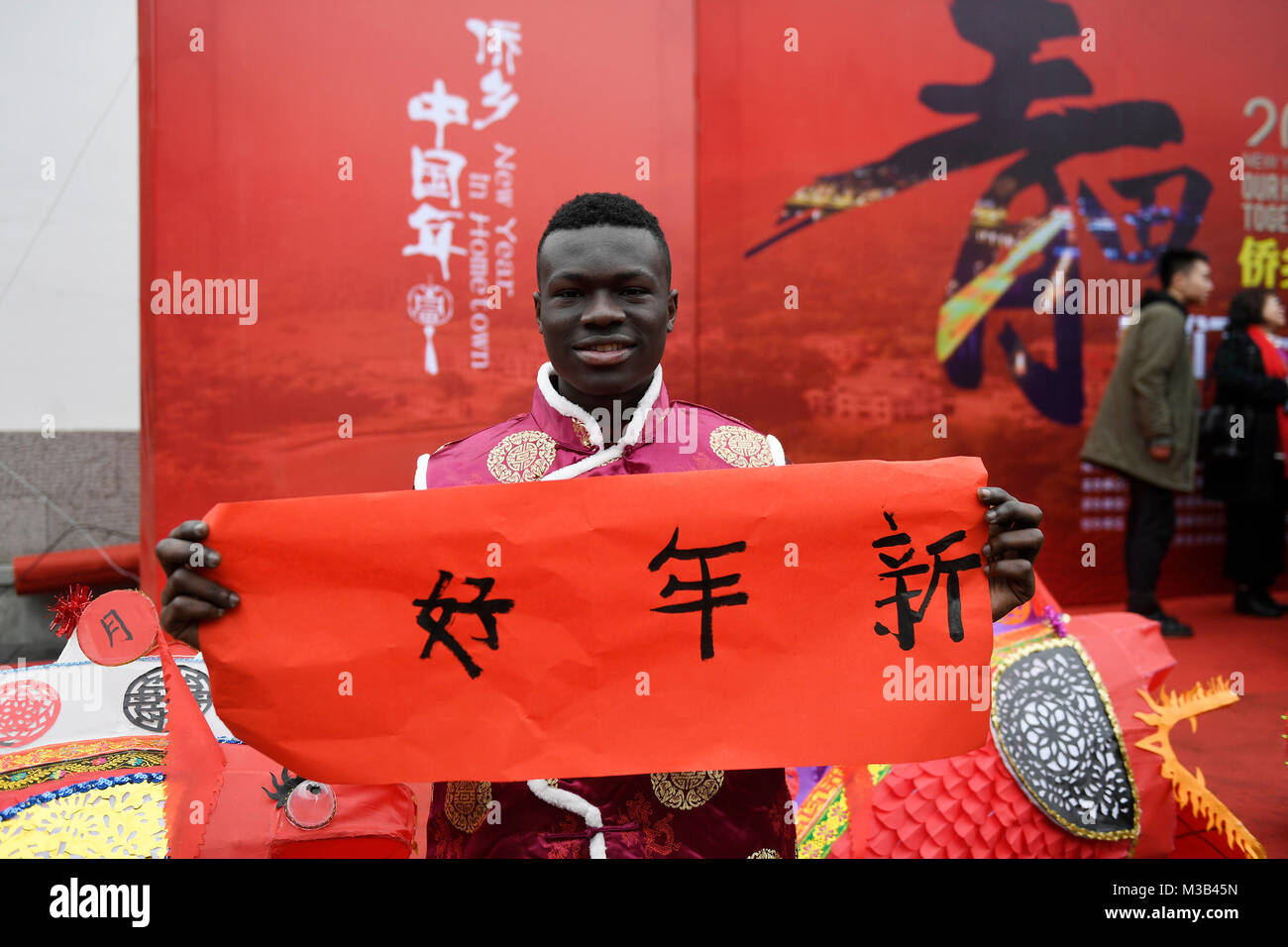 Dongbei, Zhejiang, China. 10th Feb, 2018. A Ghanaian shows his ...