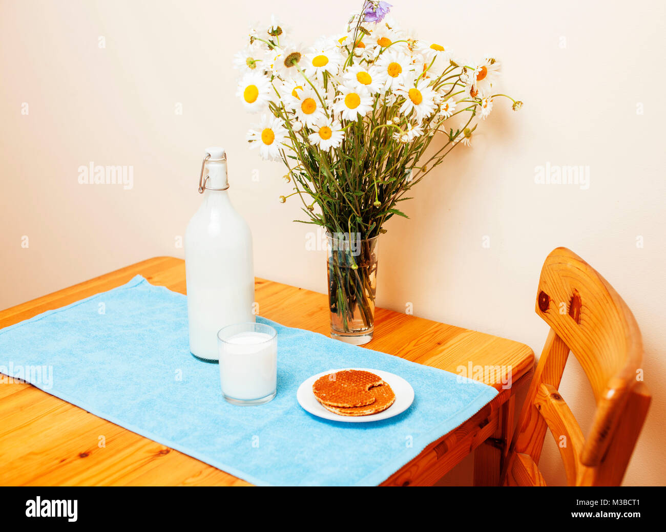 Simply stylish wooden kitchen with bottle of milk and glass on t Stock ...