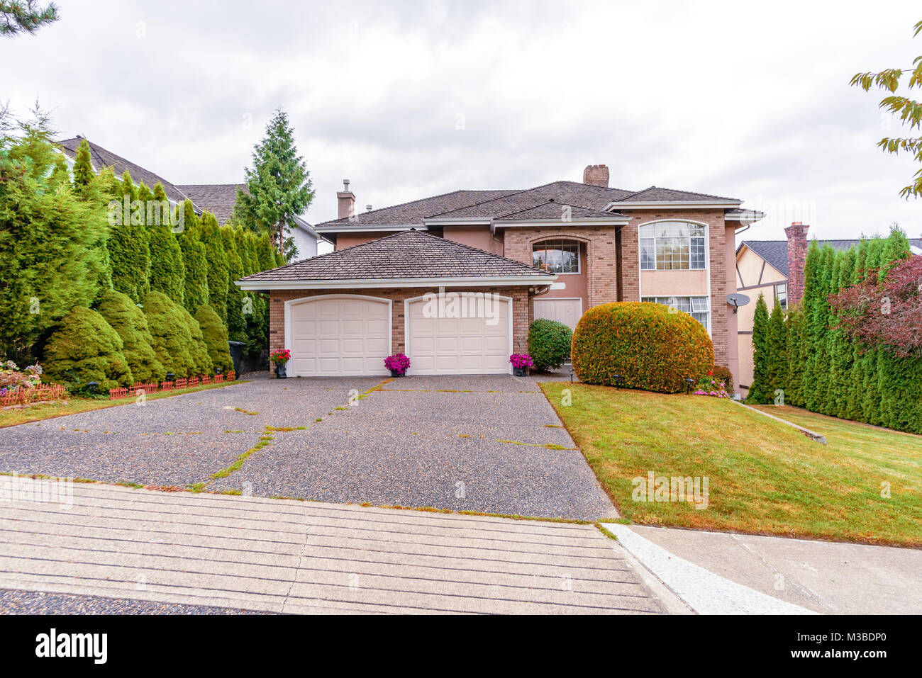 A typical American private house with a garage for a family in a suburb of a metropolis Stock ...