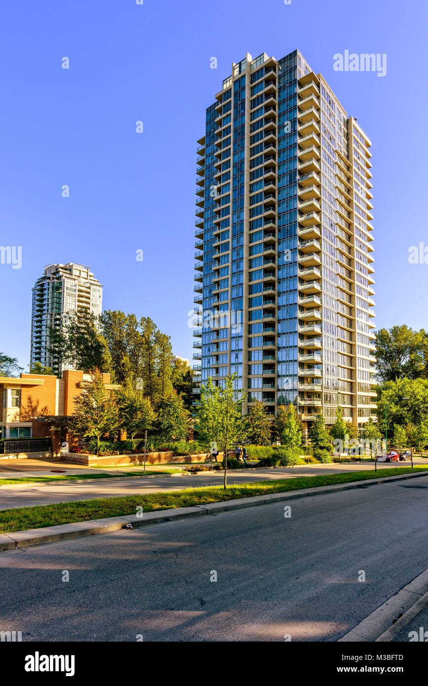 The facade of a modern multi-storey building of glass and concrete on a ...