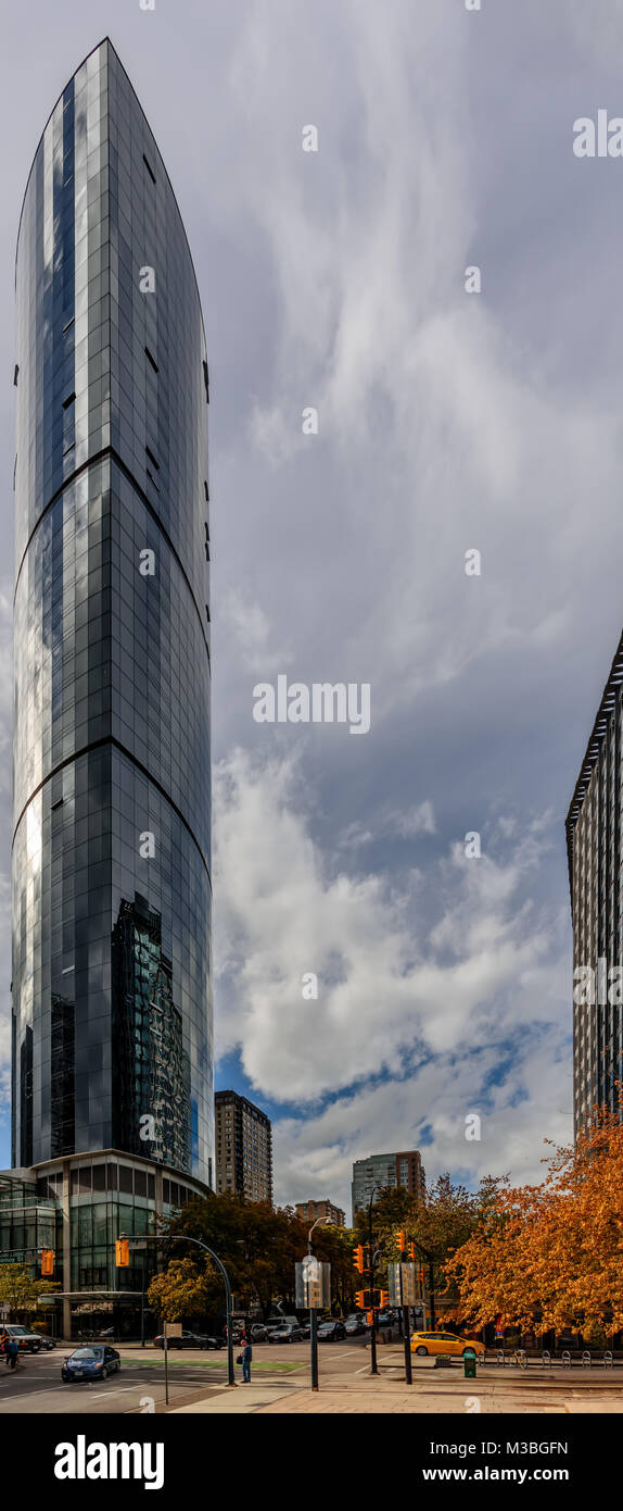 The facade of a modern multi-storey building of glass and concrete on a ...