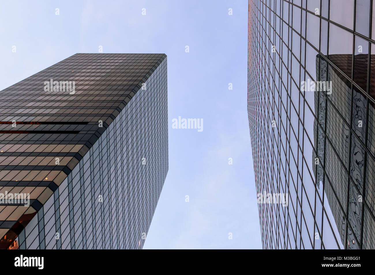 The facade of a modern multi-storey building of glass and concrete on a ...