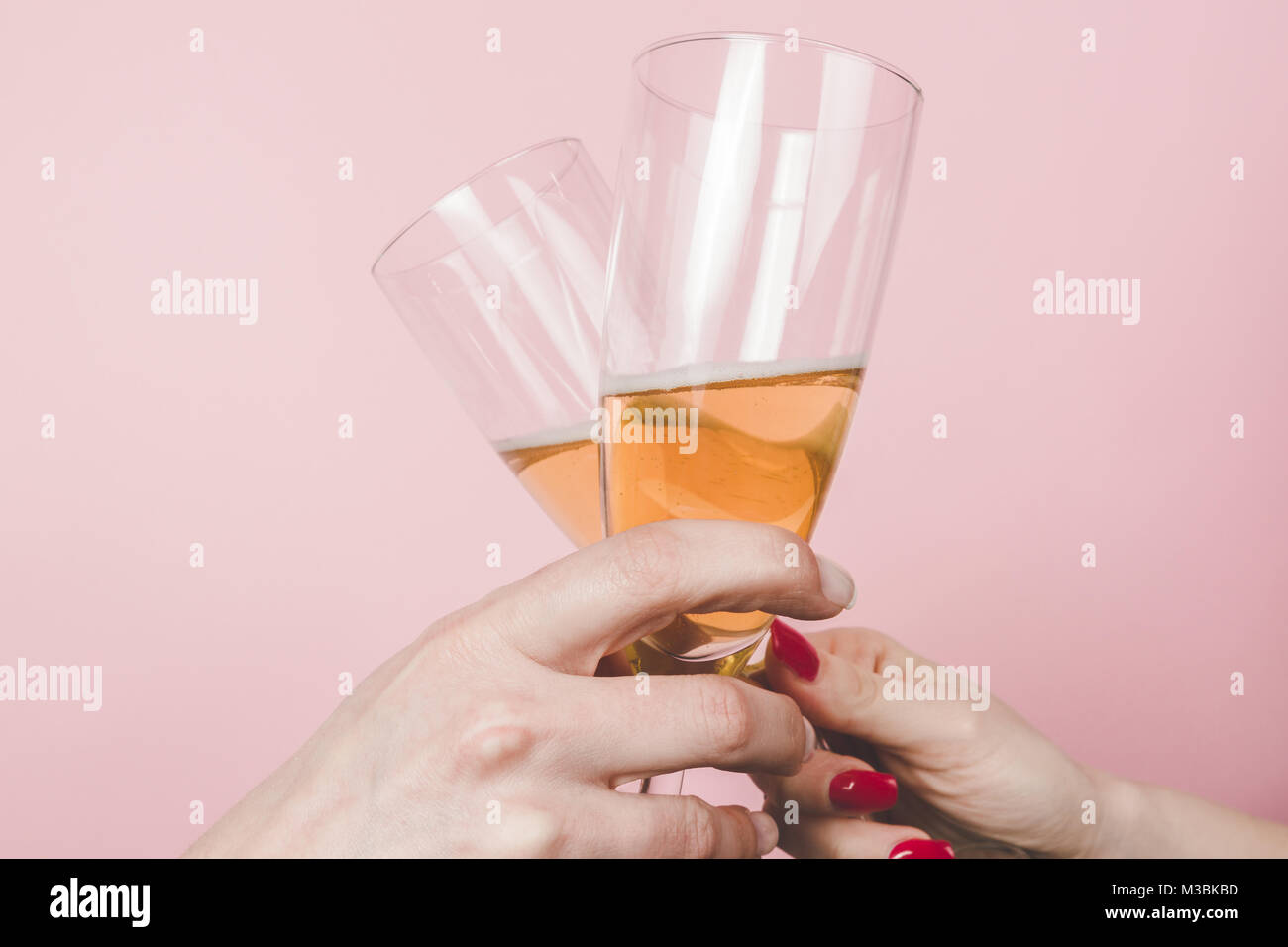 Happy couple making cheers white hi-res stock photography and images ...