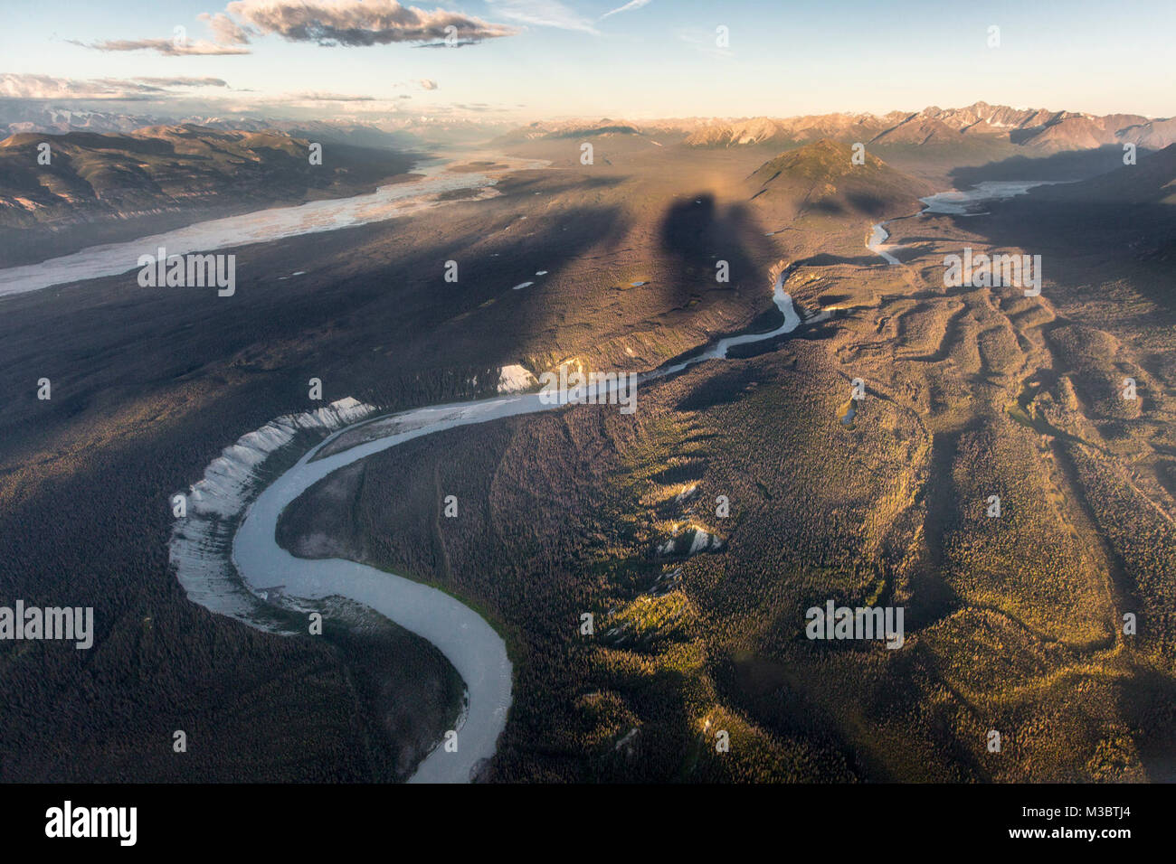 Sunset shadows on the Chitina (left) and Tana (right rivers Stock Photo ...