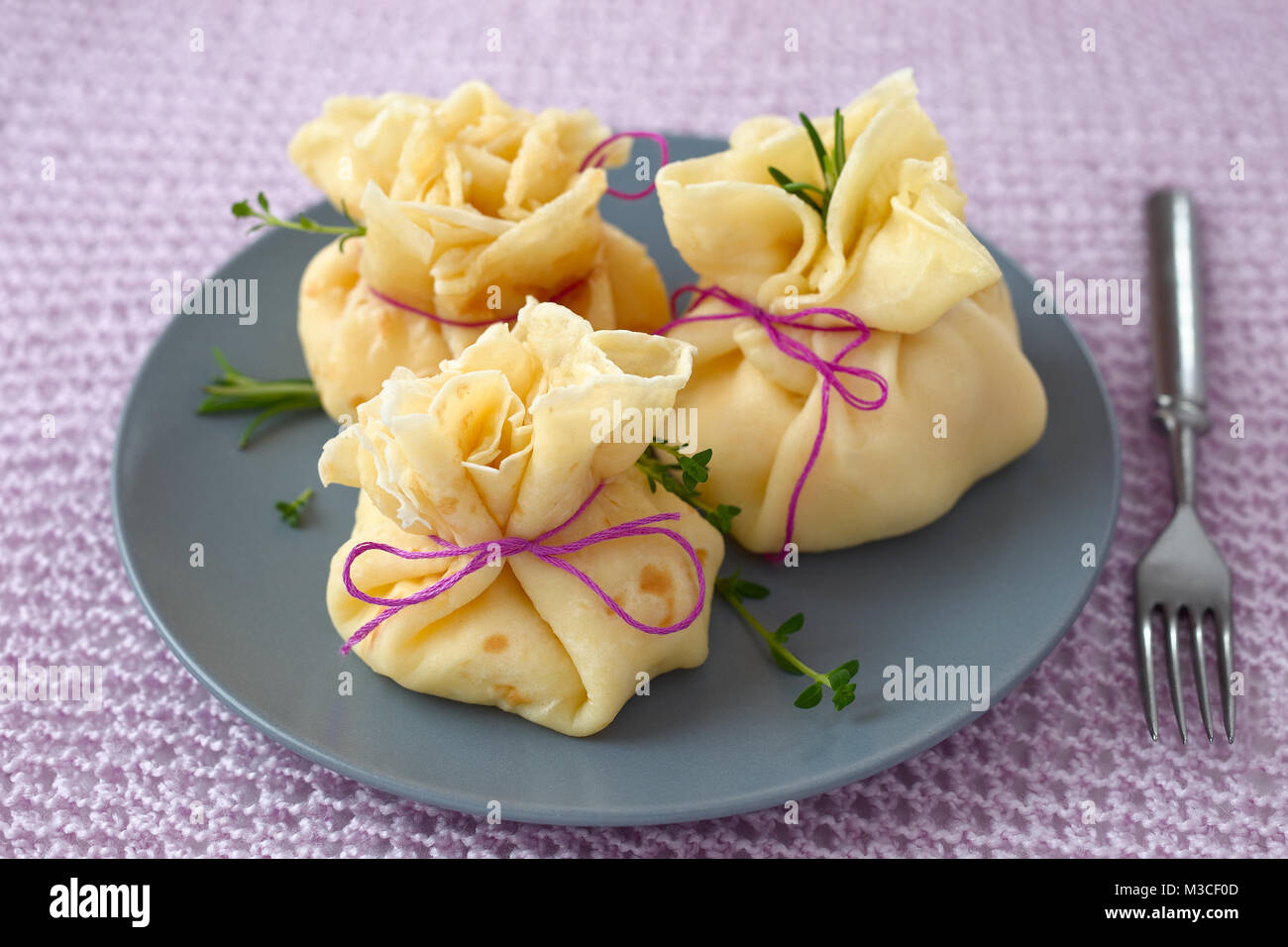 Crepe purse filled with cream cheese Stock Photo - Alamy