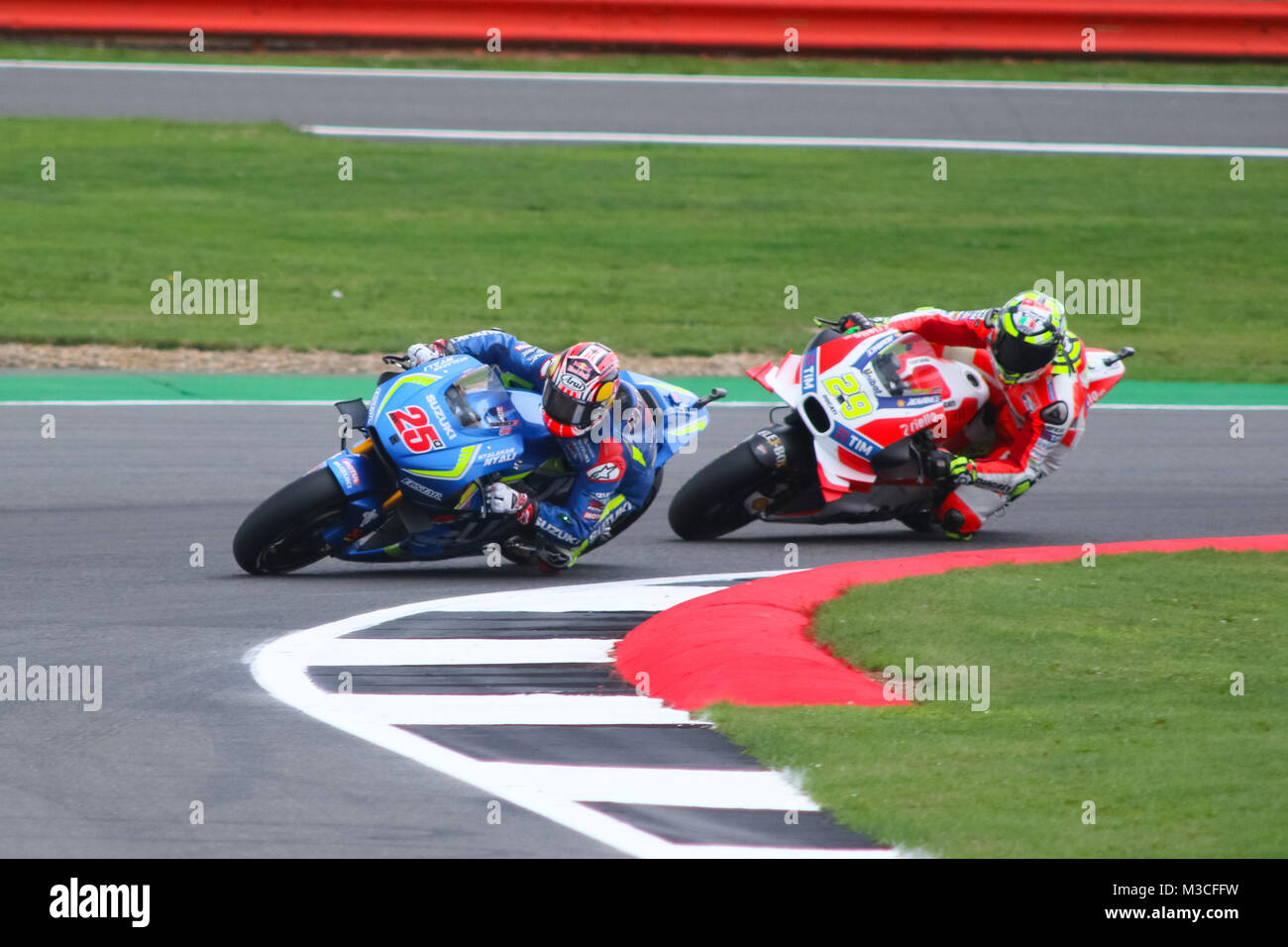 Maverick Vinales leads Andrea Iannone through Vale corner during Friday ...