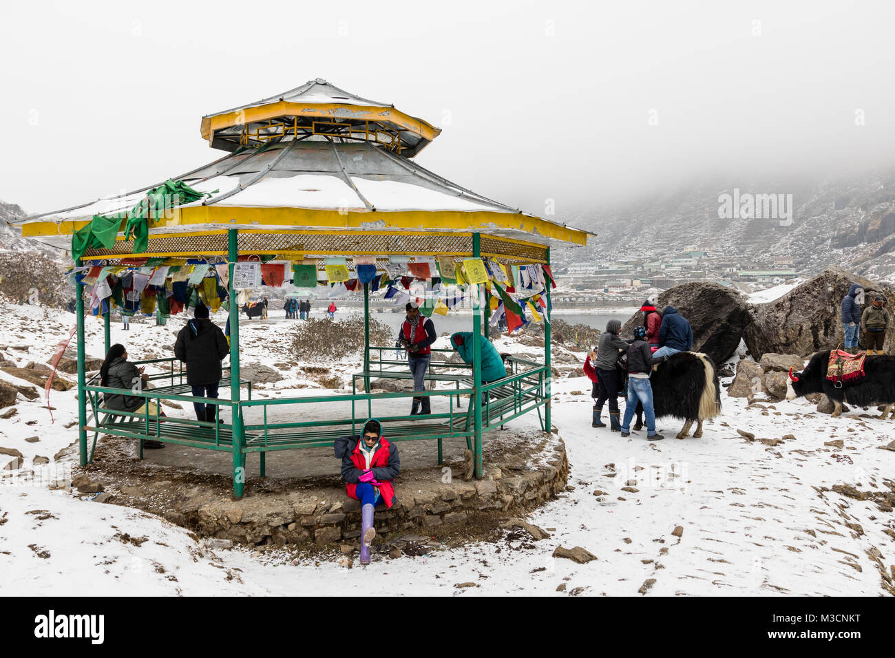 SIKKIM, INDIA, March 9 2017: Tourists at the Tsomgo (Changu) Lake in Sikkim. It is a sacred ...