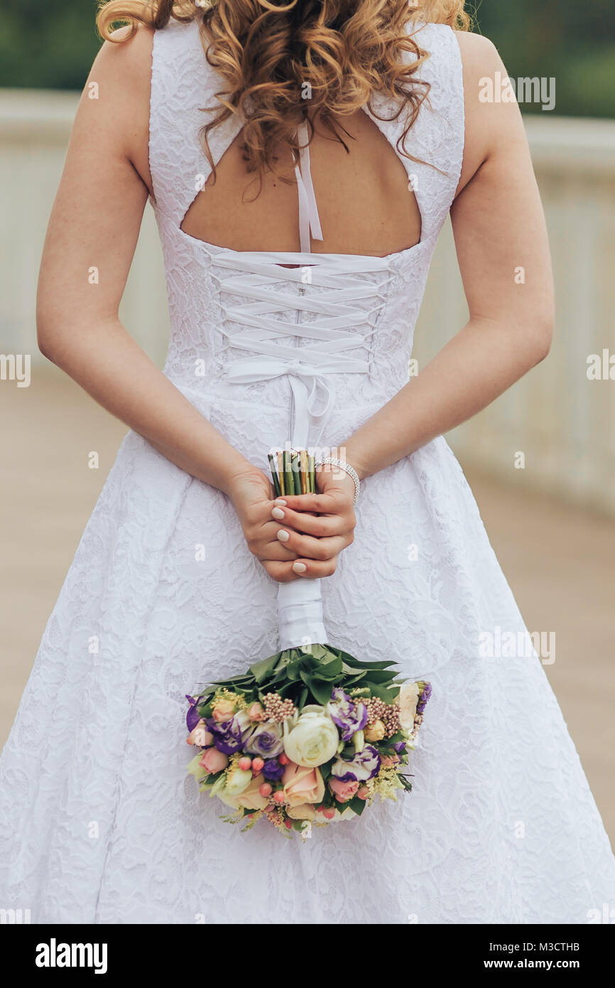 Bride holding her bridal bouquet Stock Photo - Alamy