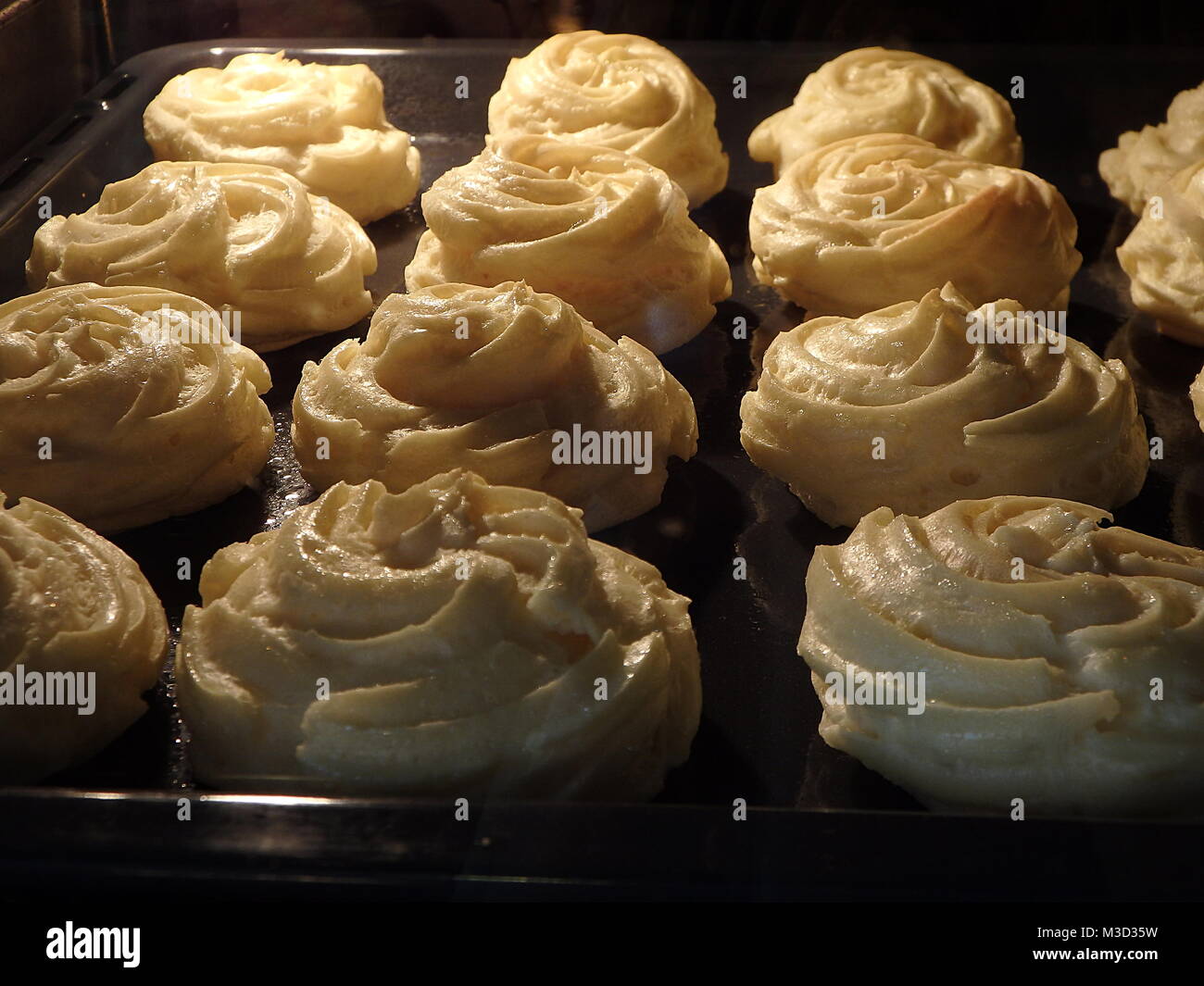 Preparation of sweet cakes, Cream puff rings cakes (eclair), Custard ...