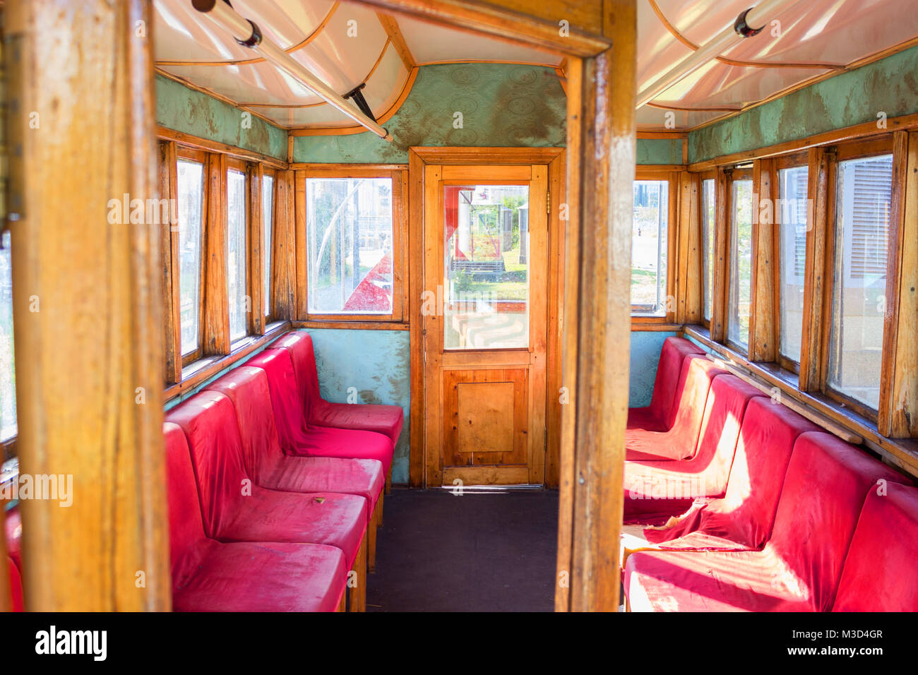 Inside of an old Train with damaged red chairs Stock Photo - Alamy