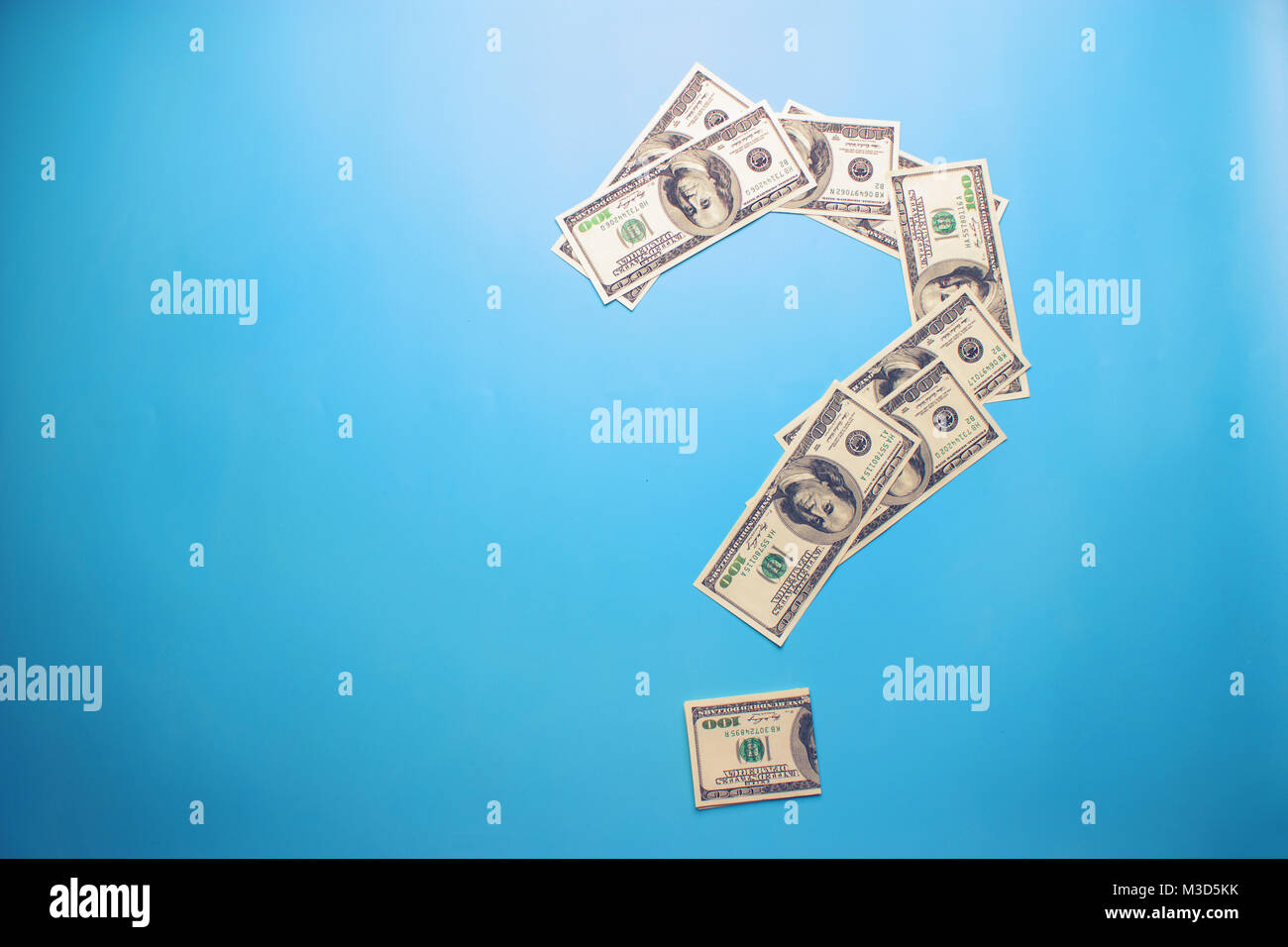 dollar in a form of question mark on blue background Stock Photo - Alamy