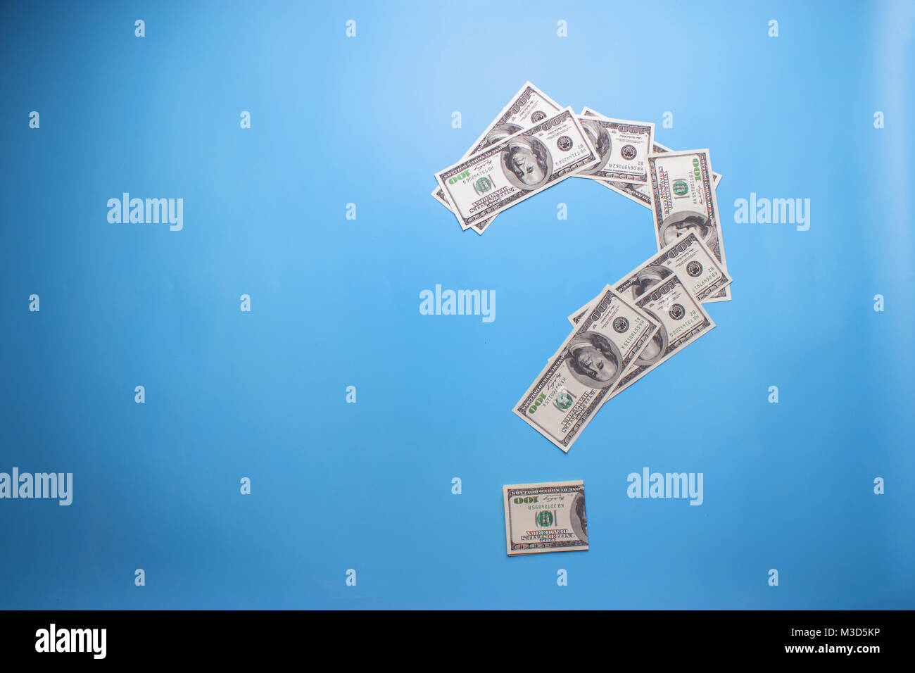 dollar in a form of question mark on blue background Stock Photo - Alamy